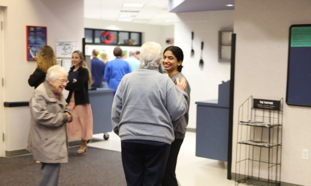 Student Divya Murali greets an ASC sister with a smile at the prayer ...